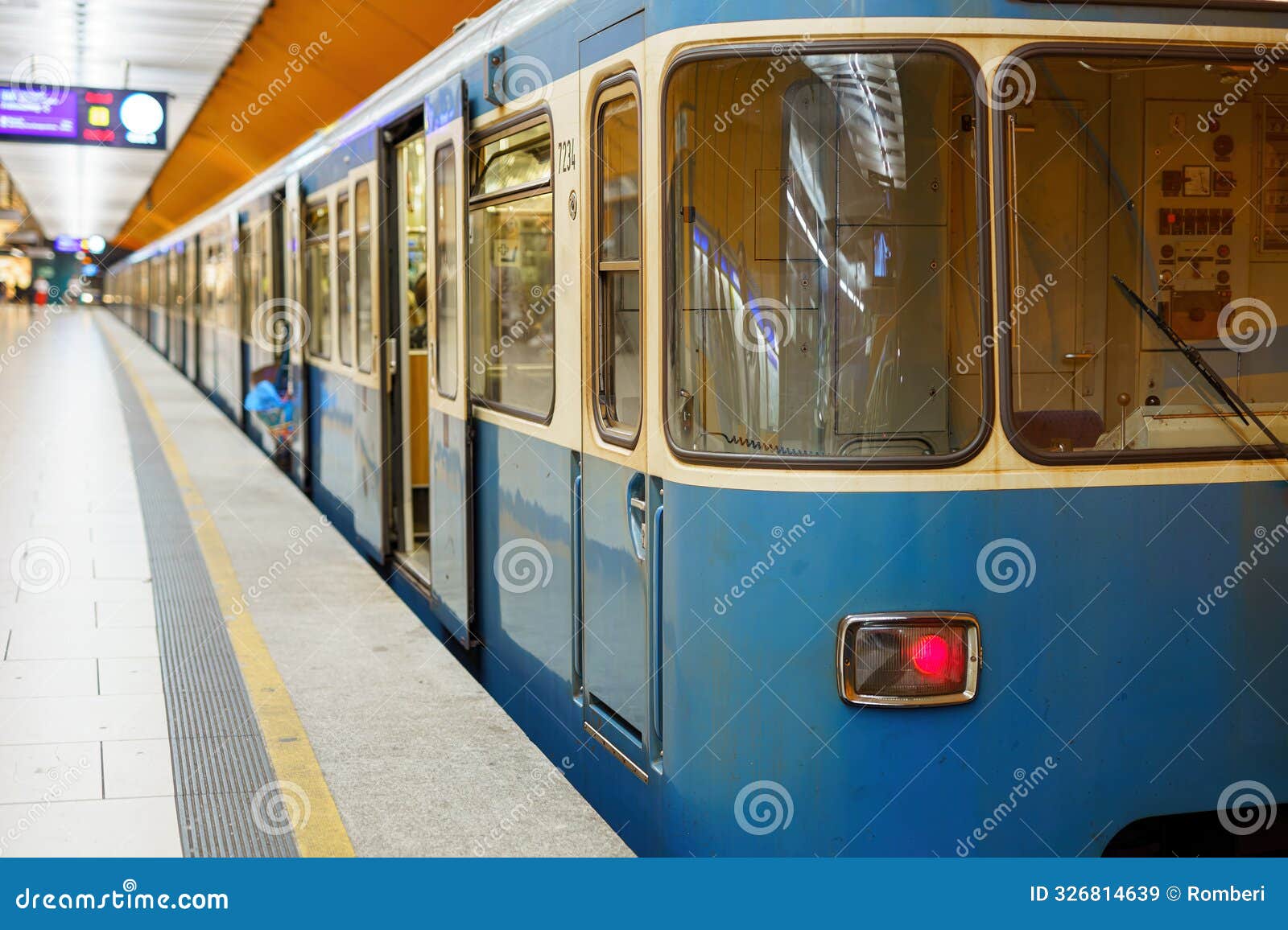 An Electric Train with Metro Passengers in an Underground Metro Station ...