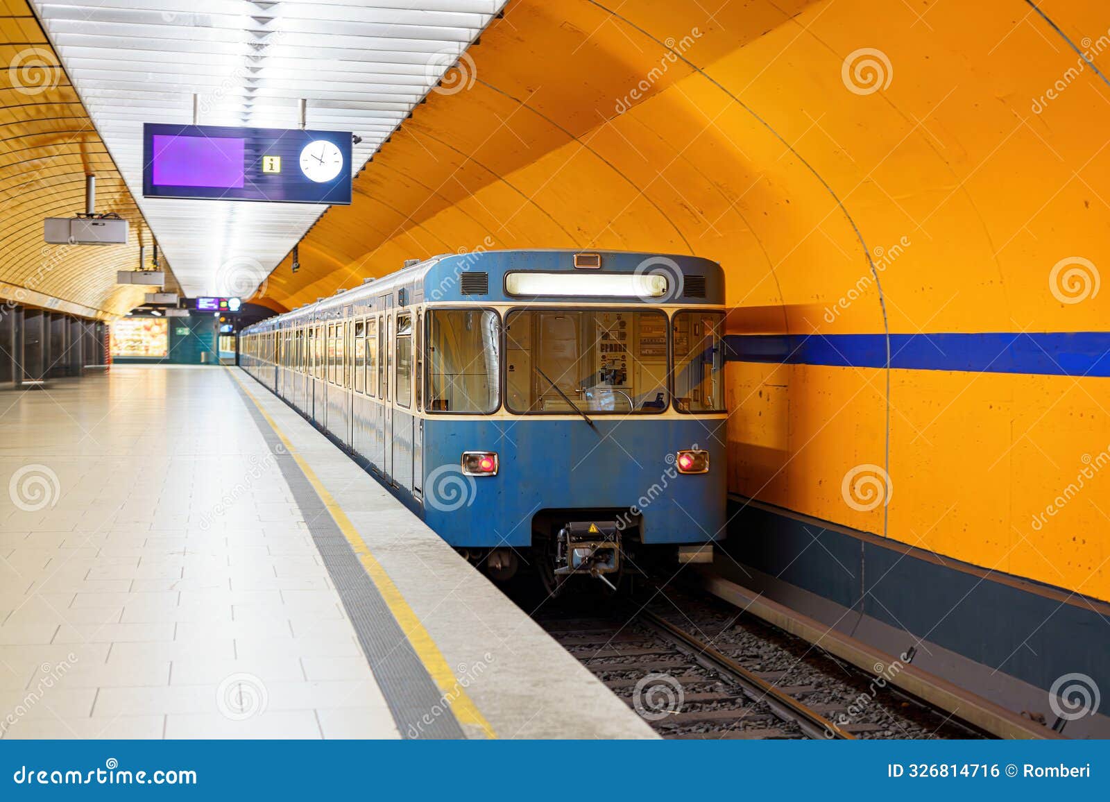 An Electric Train with Metro Passengers in an Underground Metro Station ...
