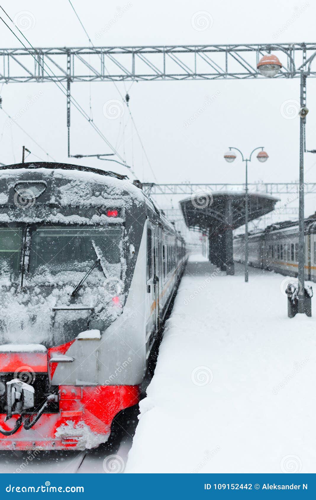 Electric Train in Snow in a Blizzard on an Empty Platform Stock Photo ...