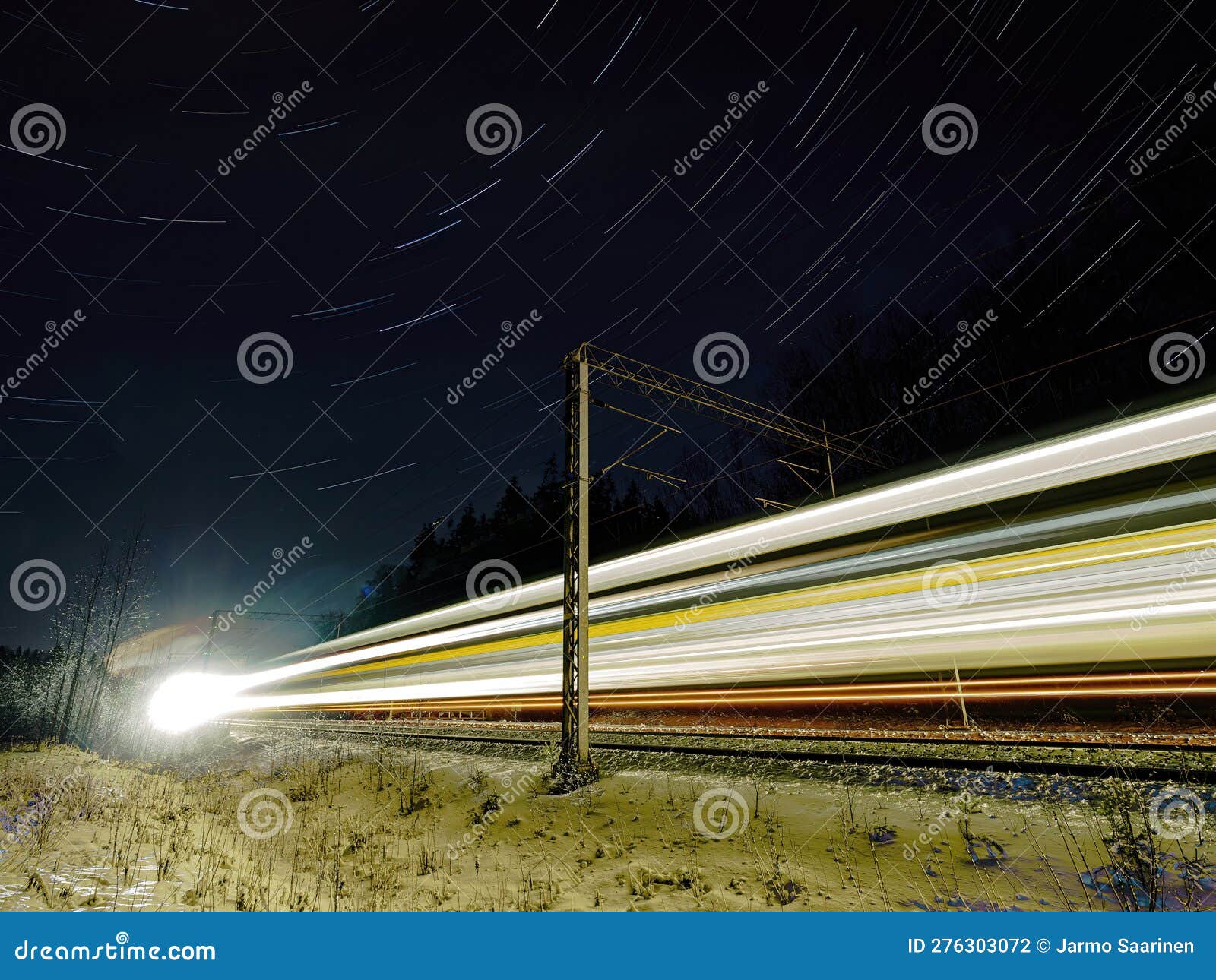 Electric Train at Speed at Night with Short Star Trails. Stock Photo ...