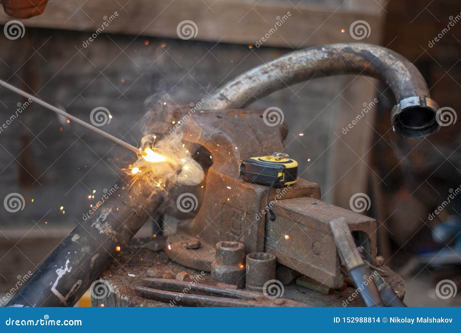Electric Welding of Metal. Exhaust Pipe, Work with Metal Objects. Stock ...