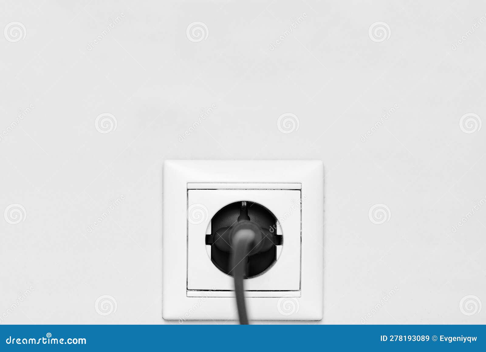 Electric White Socket and One Plugged in Power Cord on White Wall ...