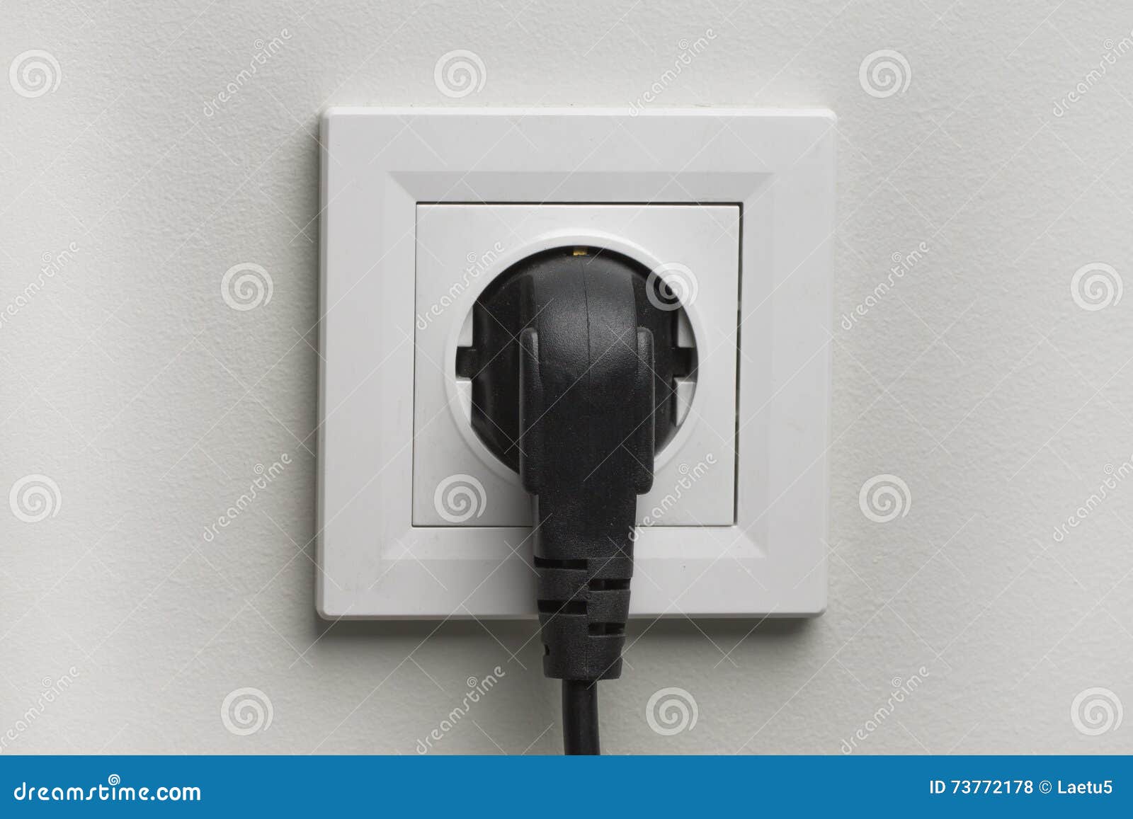 Electric White Socket And One Plugged In Power Cord On White Wall ...