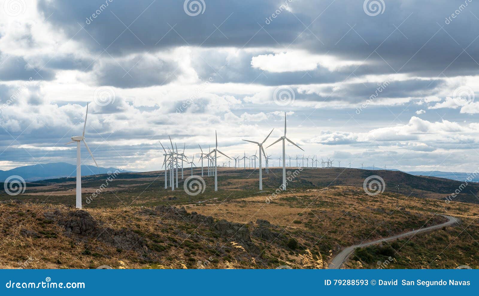 Electric Wind Mills Moved by the Wind Over Cloudy Sky Background Stock ...