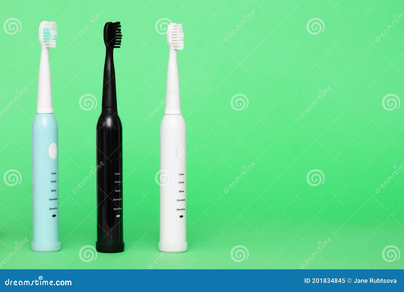 Electric Wireless Toothbrushes in Blue, Black and White on a Light ...