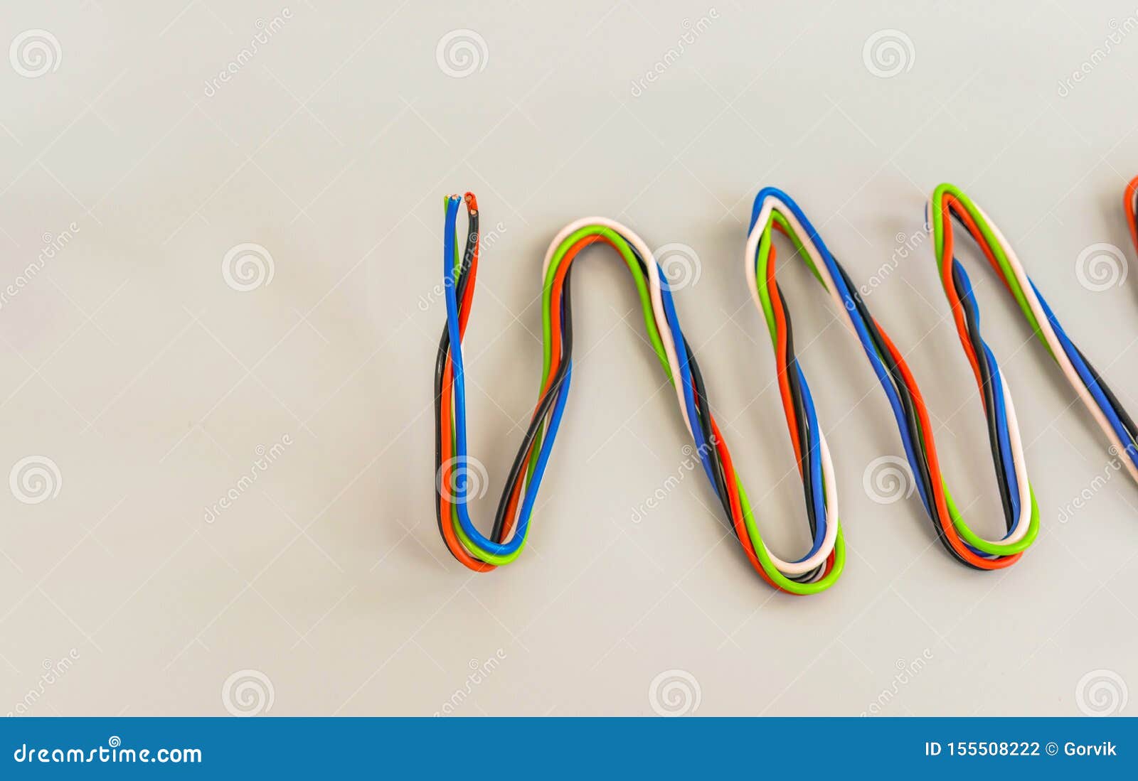 Electric Wires of Different Colors in Curved Form on a Gray Background ...