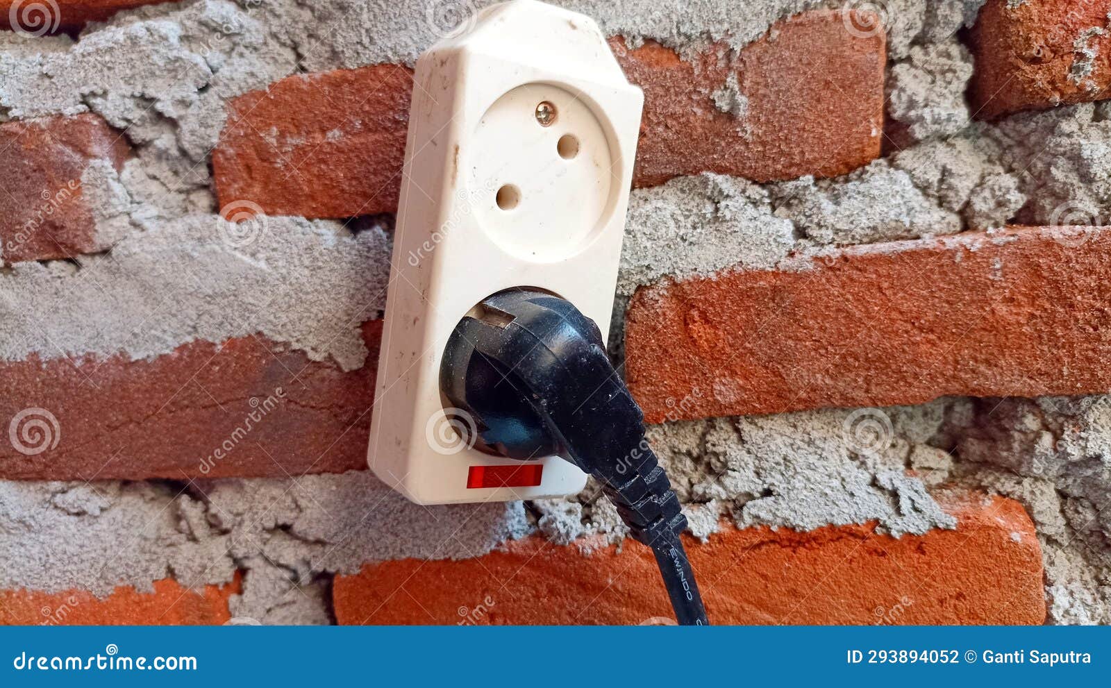 Electrical Cable Plug Attached To the Red Brick Wall Stock Photo ...