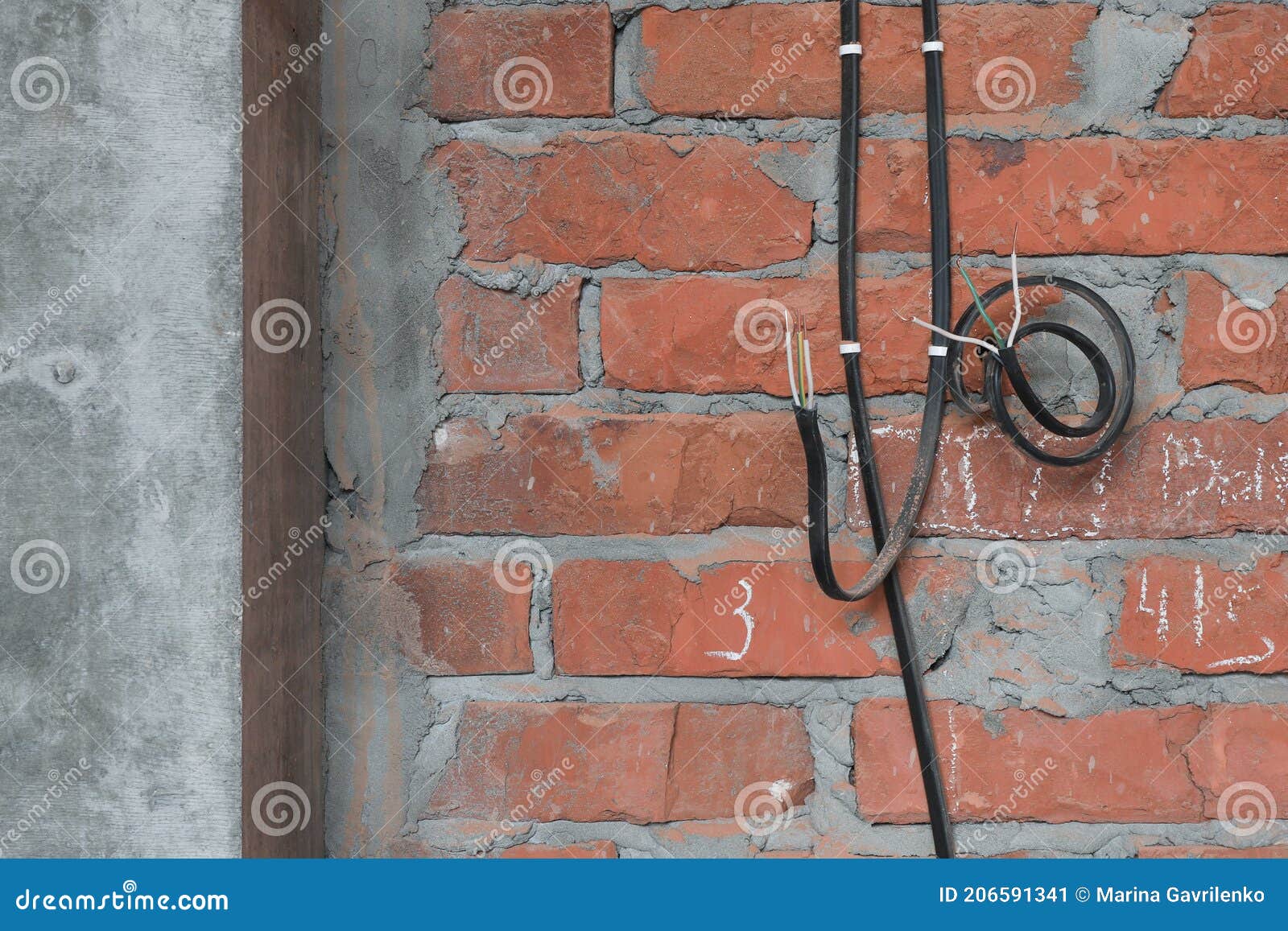 Electrical Cables are Fixed To a Brick Wall for Future Outlets Next To ...