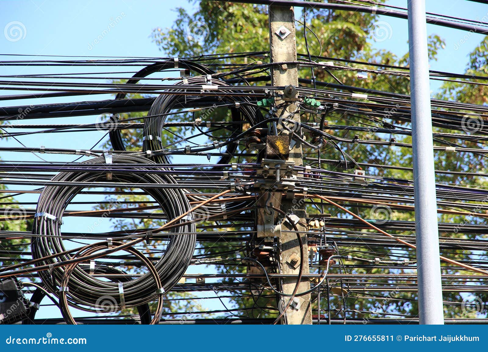 Electrical and Communication Cables Disorderly Tied. it Can Cause Harm ...