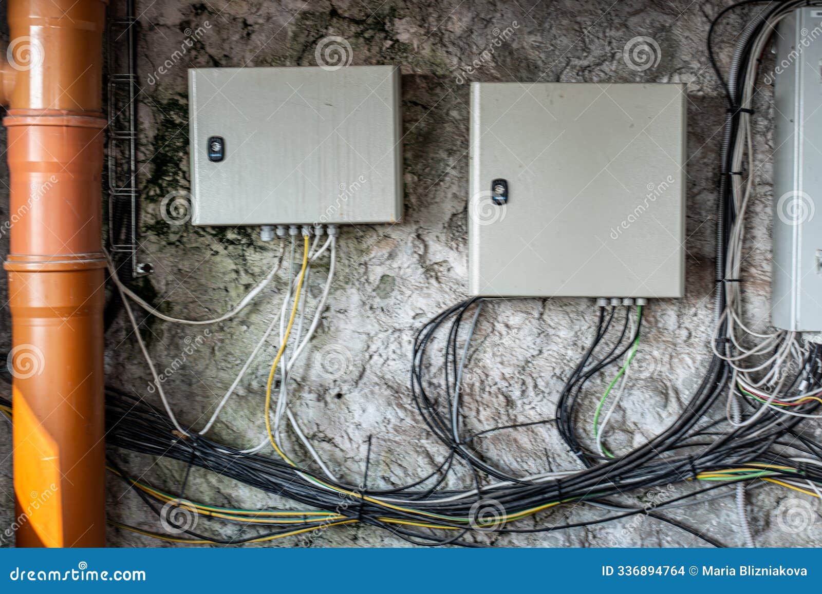 Electrical Control Boxes with Cables Mounted on an Old Stone Wall Next ...