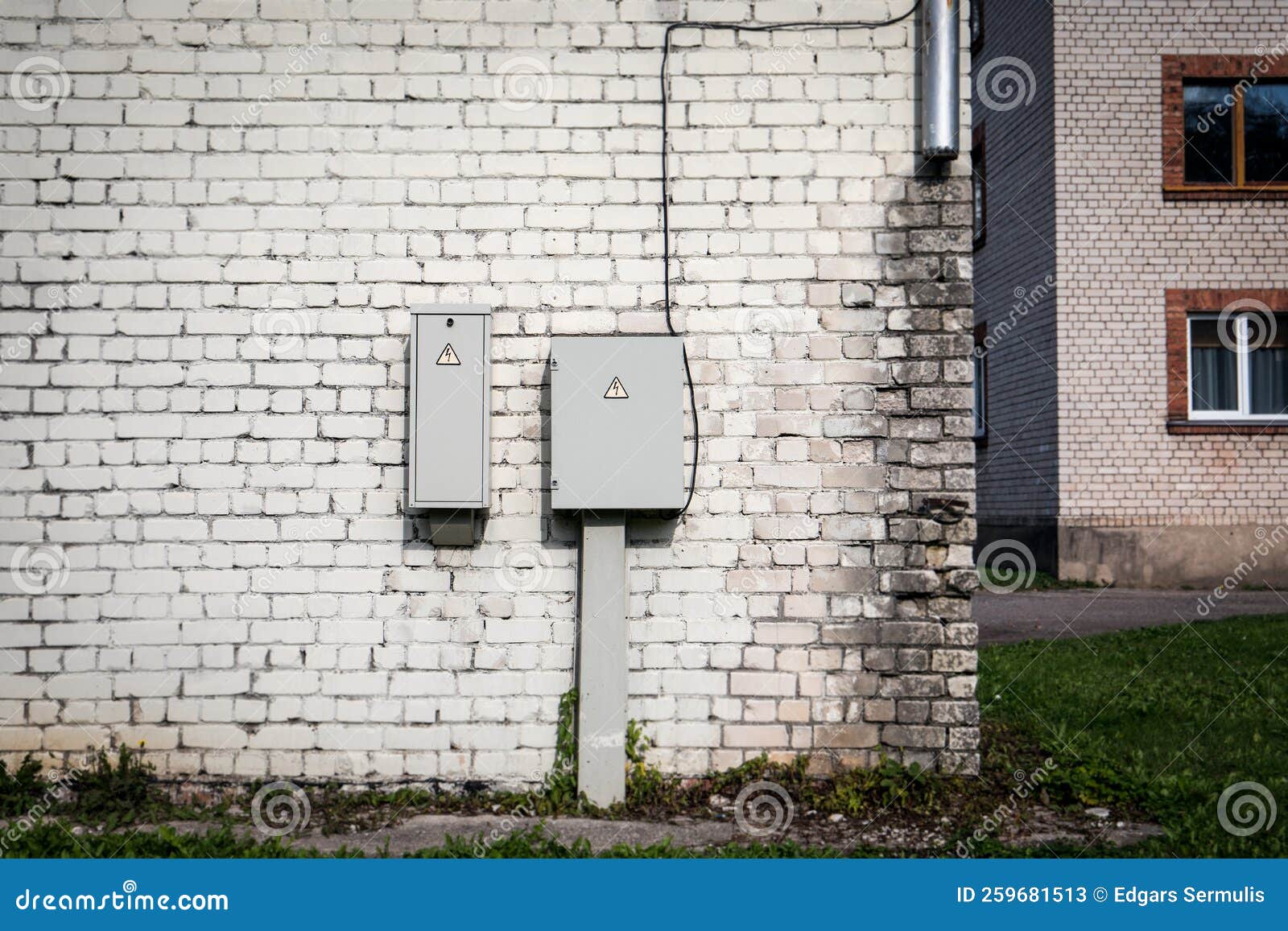 Electrical Distribution Boxes Against a White Brick Wall Stock Image ...