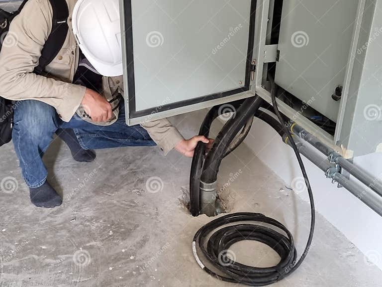 The Electrical Engineer Checking the Cable Pulling Work Stock Image ...
