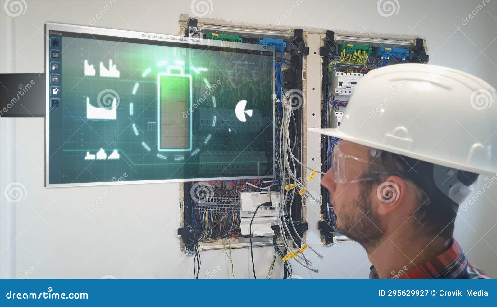 Electrical Engineer Checking Data on a Screen while Installing ...