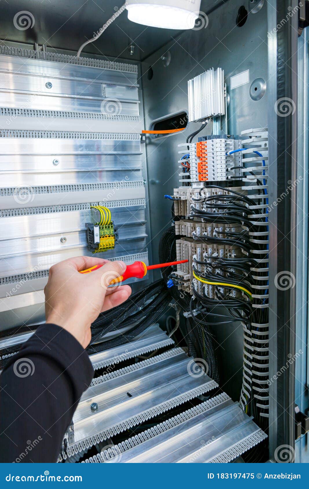 Electrical Engineer Checking Electric Cubicle and Fixing Connector ...