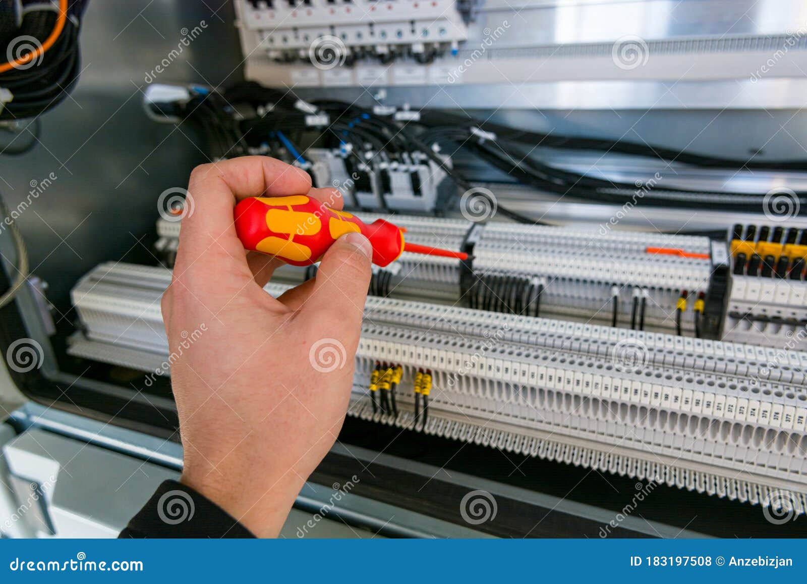 Electrical Engineer Checking Electric Cubicle and Fixing Connector ...