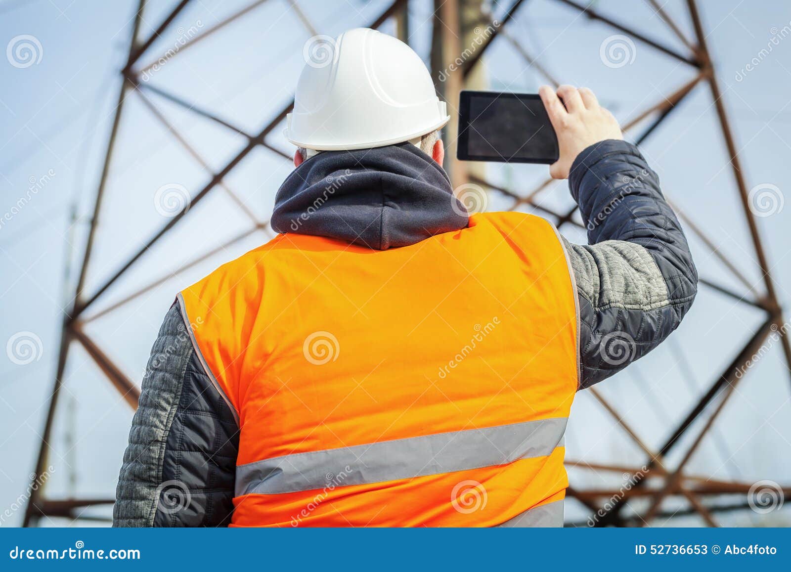 Electrical Engineer Filmed with Tablet PC High Voltage Tower Stock ...