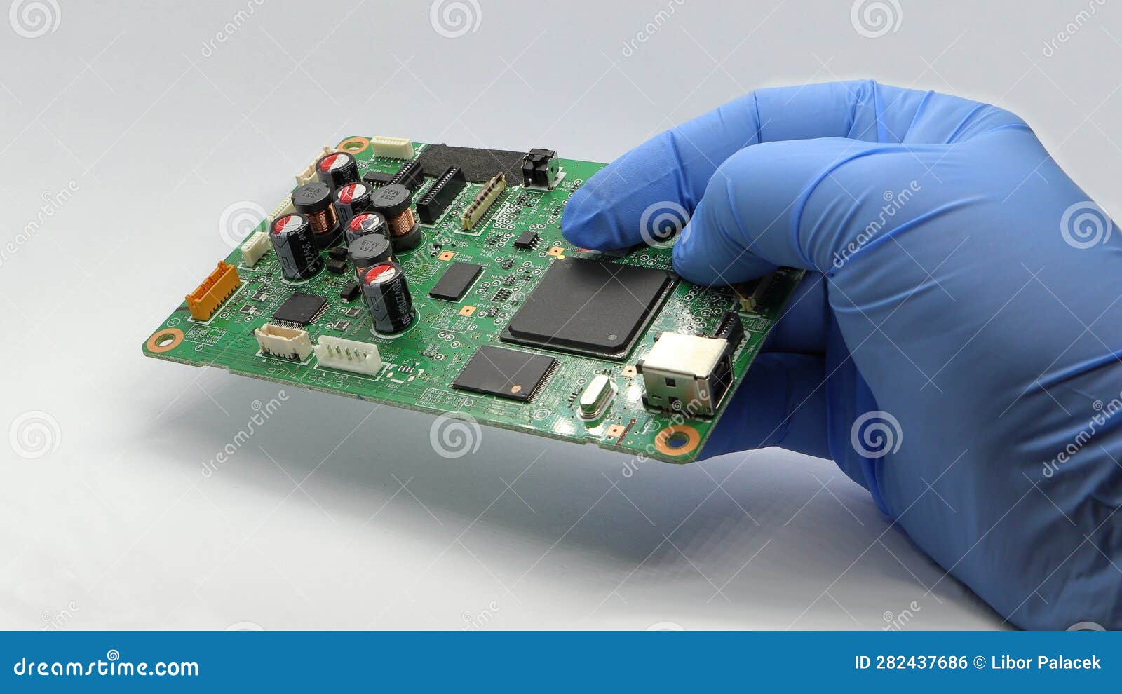 Electrical Engineer Holding a Circuit Board with Microchips in His Hand ...