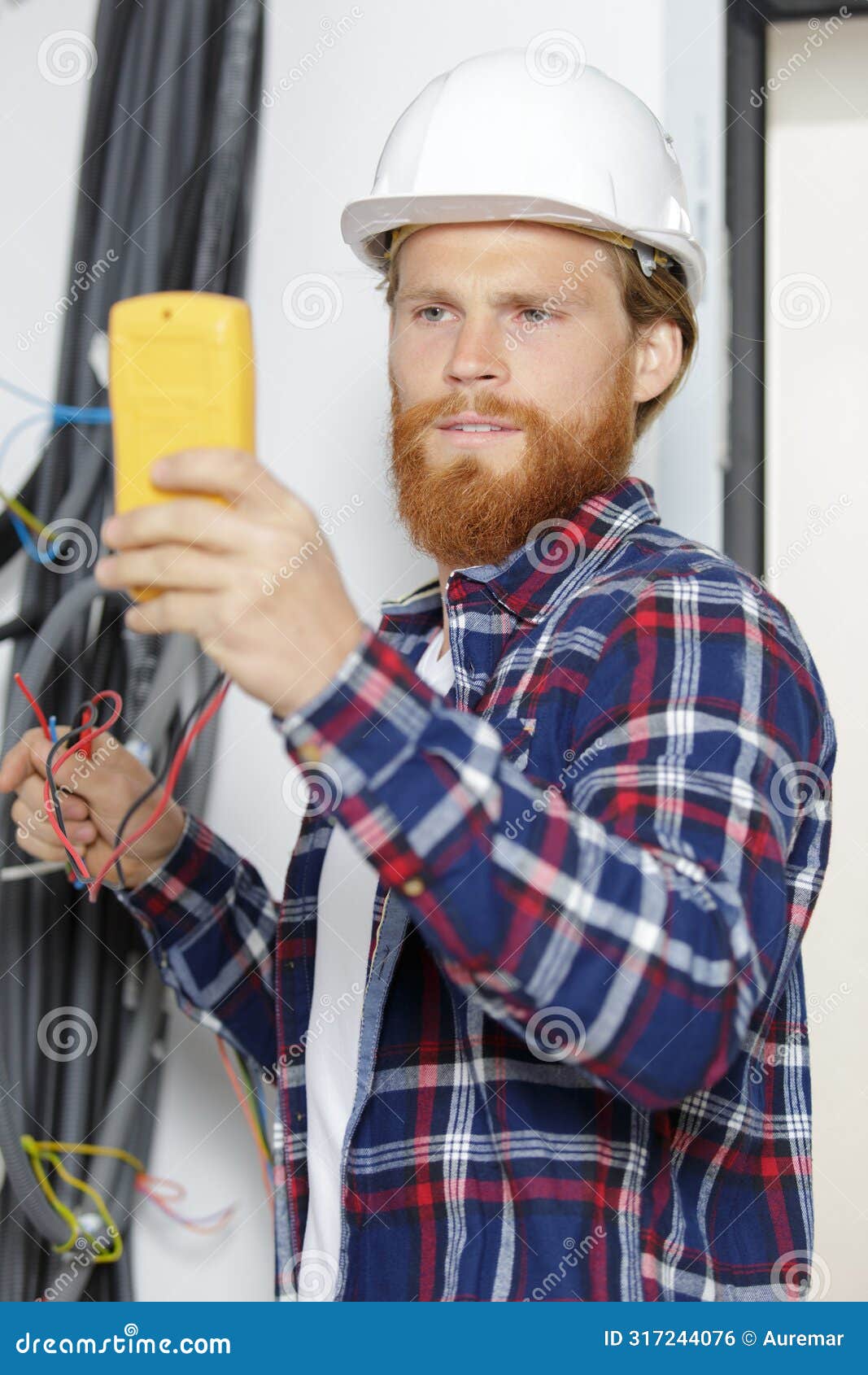 Electrical Engineer Makes Adjustments in Front Metal Box Stock Photo ...