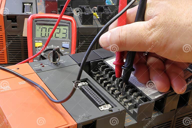 An Electrical Engineer Measures the Voltage on the Control System ...