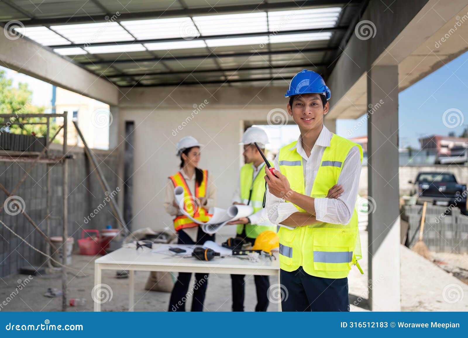 Electrical Engineer Stand with Walkie-talkie in Construction Building ...