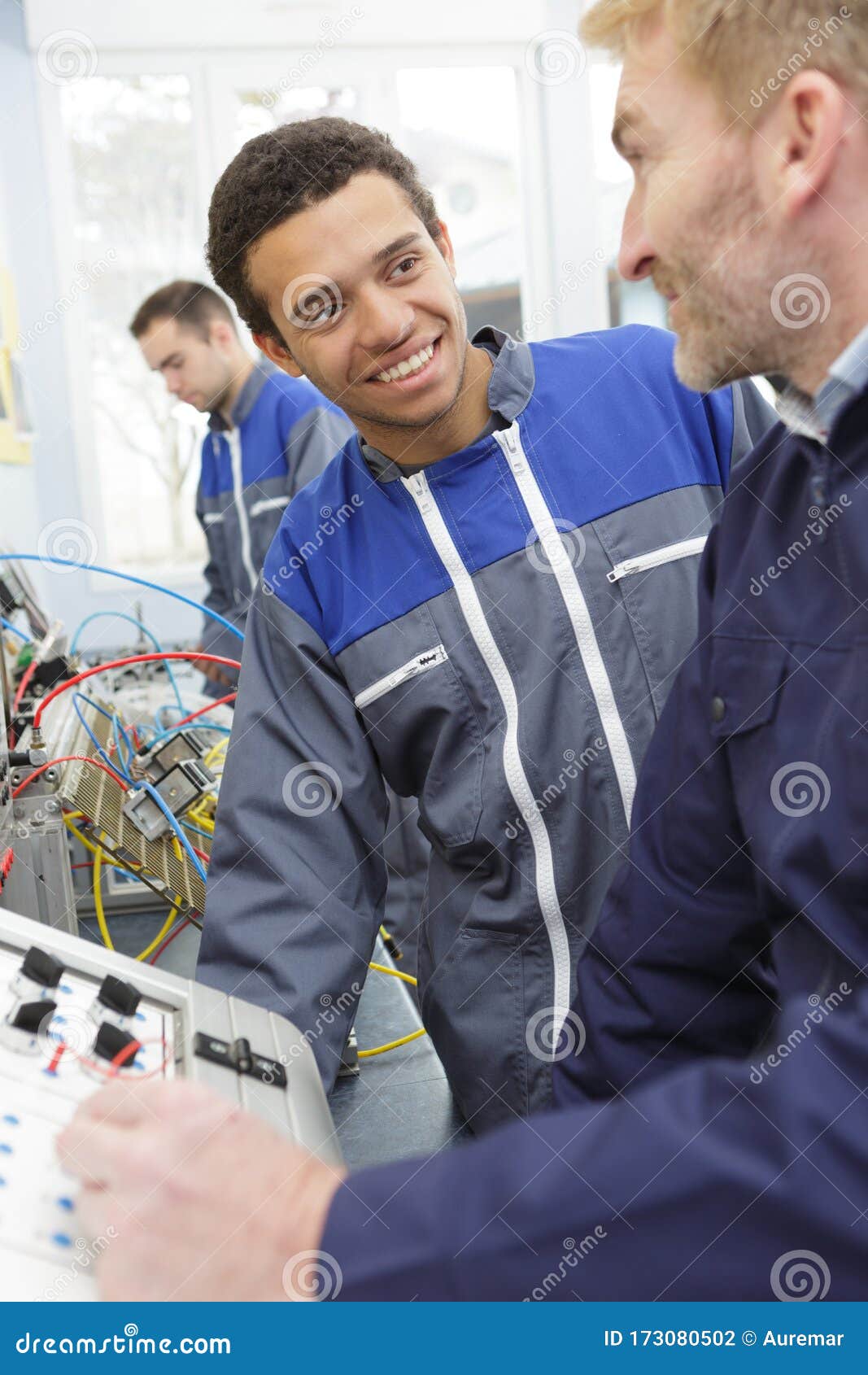 Electrical Engineer Talking To Colleague Stock Photo - Image of ...