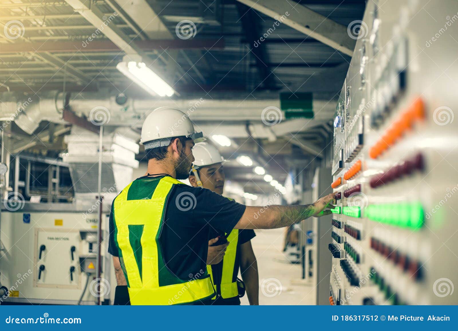 Electrical Engineer Team Working Front Control Panel. Stock Photo ...