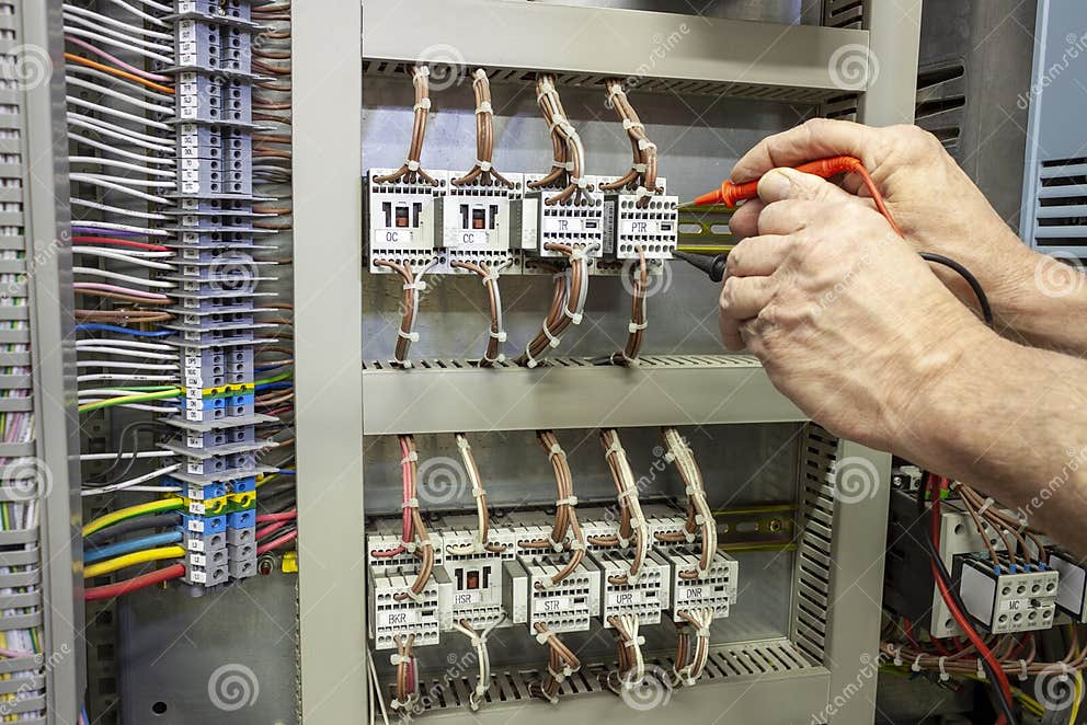 Electrical Engineer Testing a Contactor Stock Photo - Image of employee ...