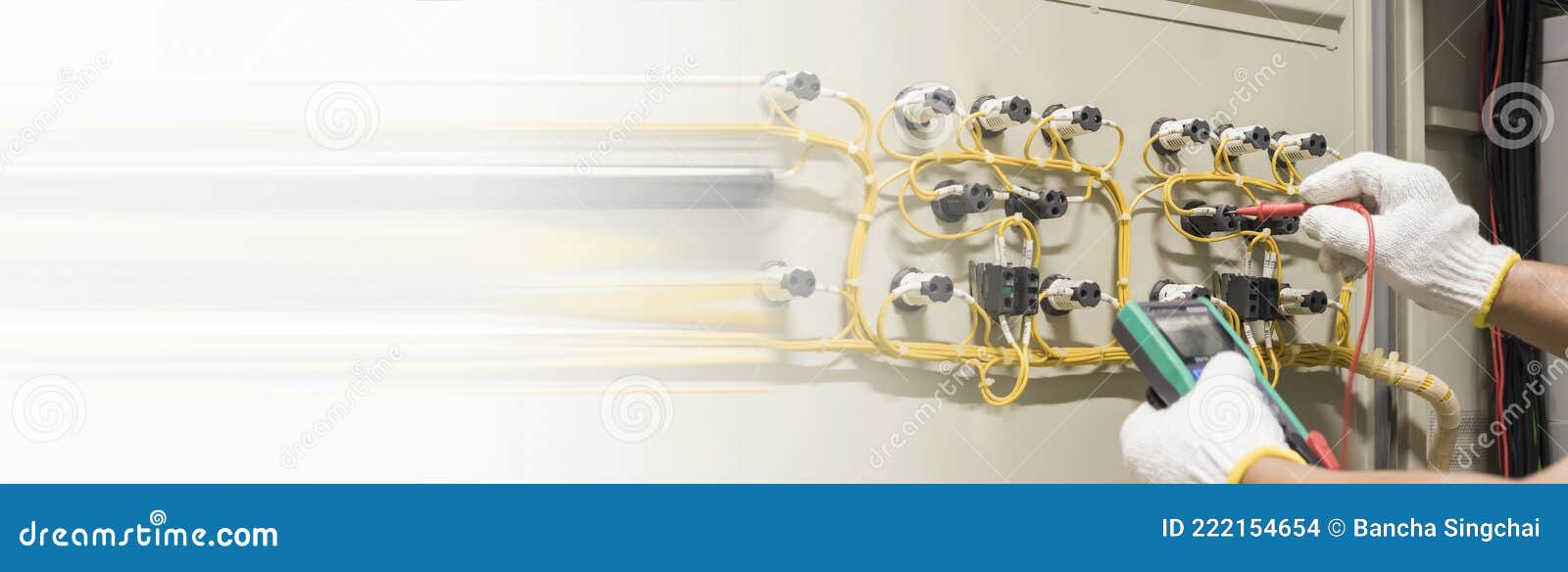 Electrical Engineer Tests the Operation of the Electric Control Cabinet ...