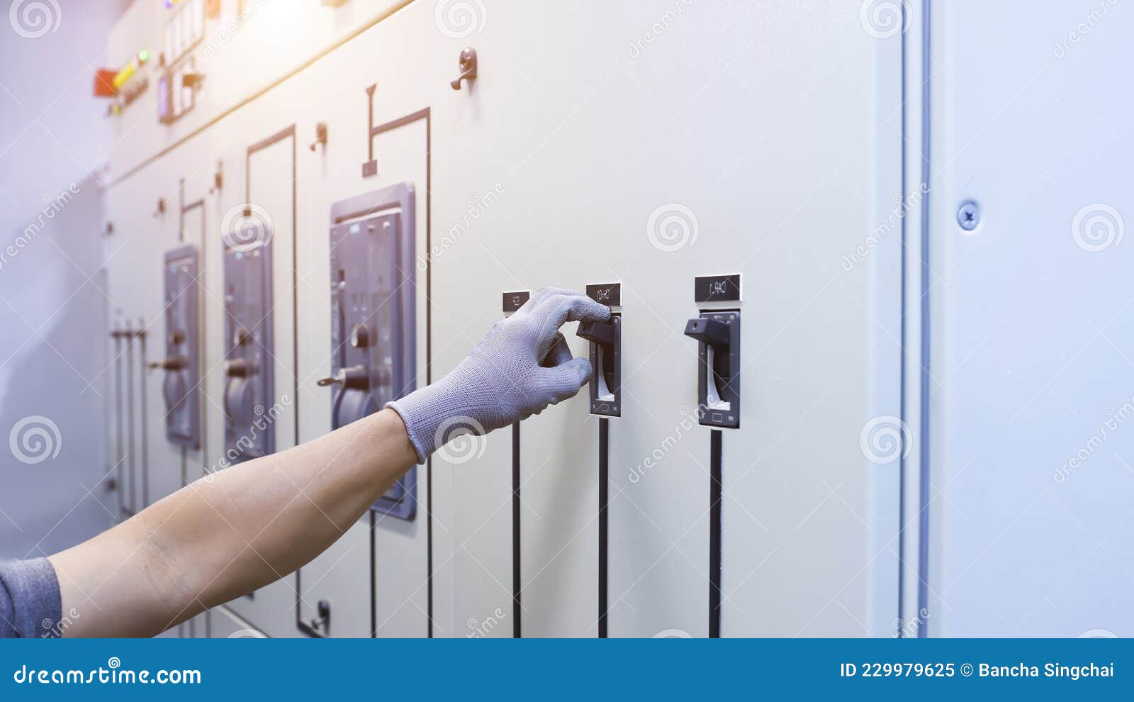 Electrical Engineer Tests the Operation of the Electric Control Cabinet ...