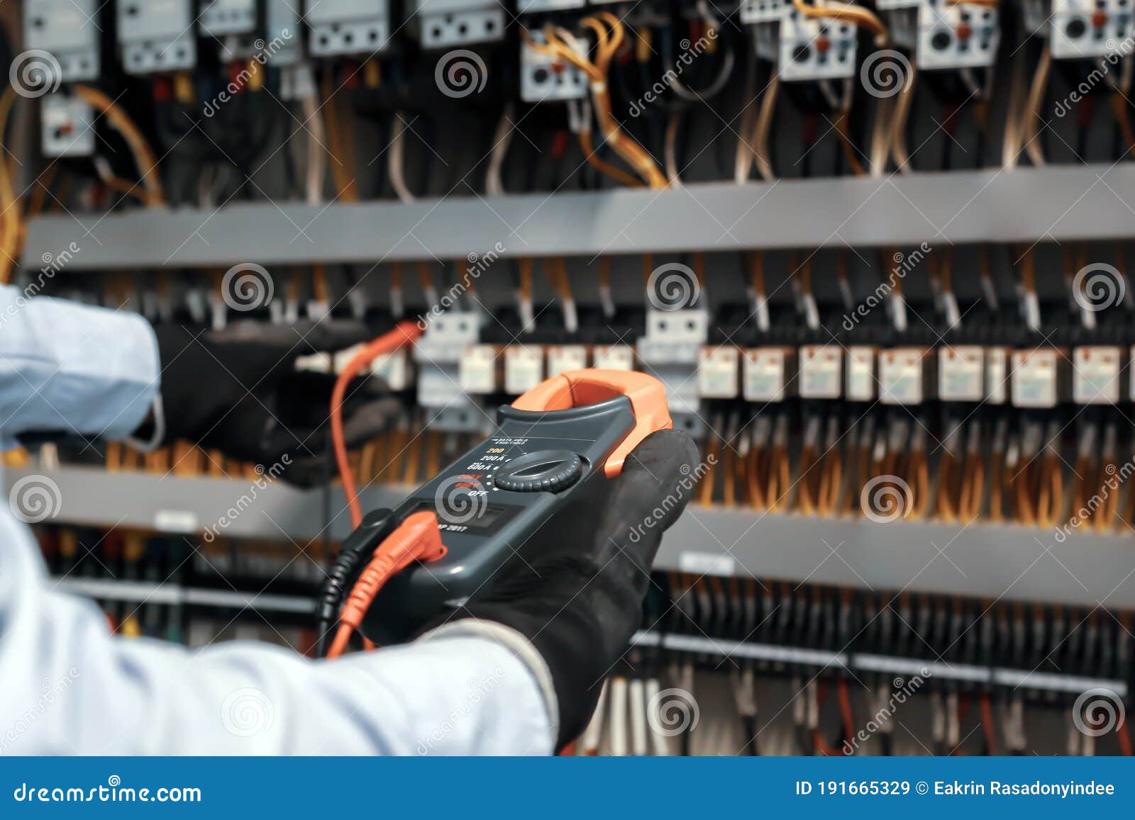 Electrical Engineer Using Digital Multi-meter Measuring Equipment To ...