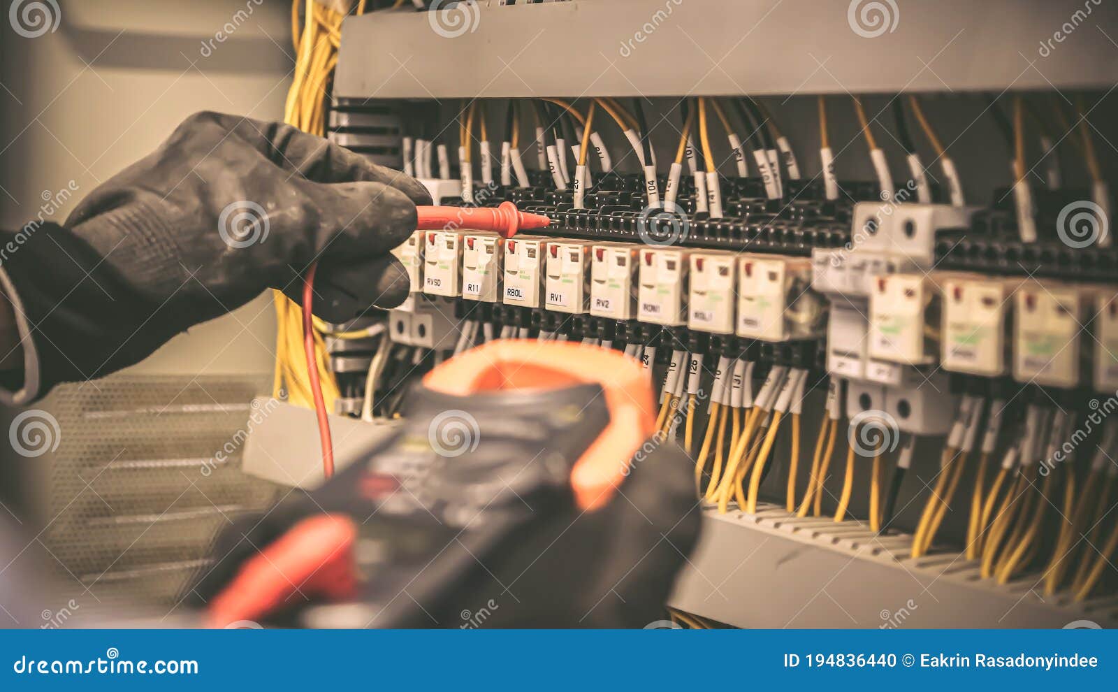 Electrical Engineer Using Digital Multi-meter Measuring Equipment To ...