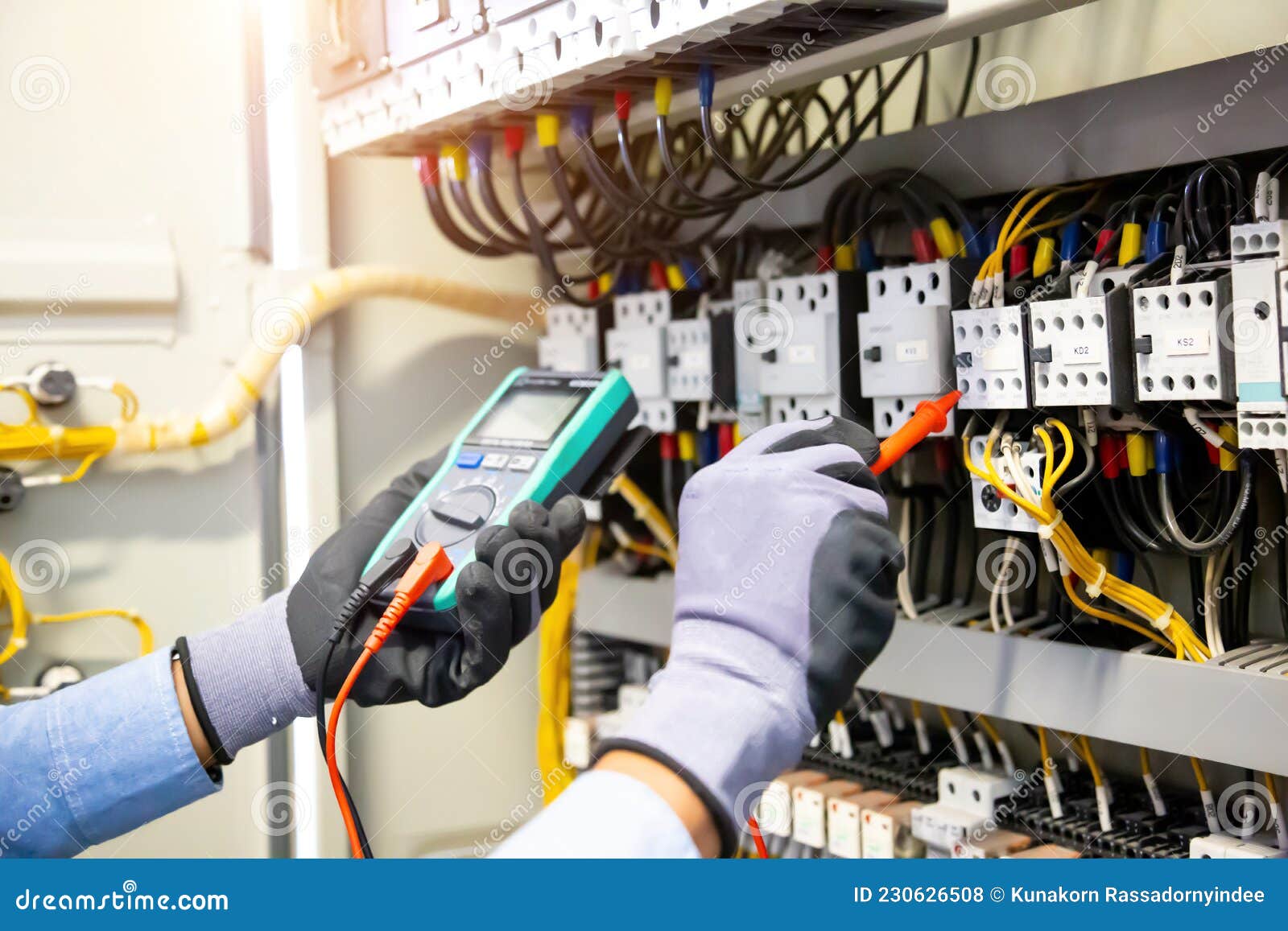 Electrical Engineer Using Digital Multi-meter Measuring Equipment To ...