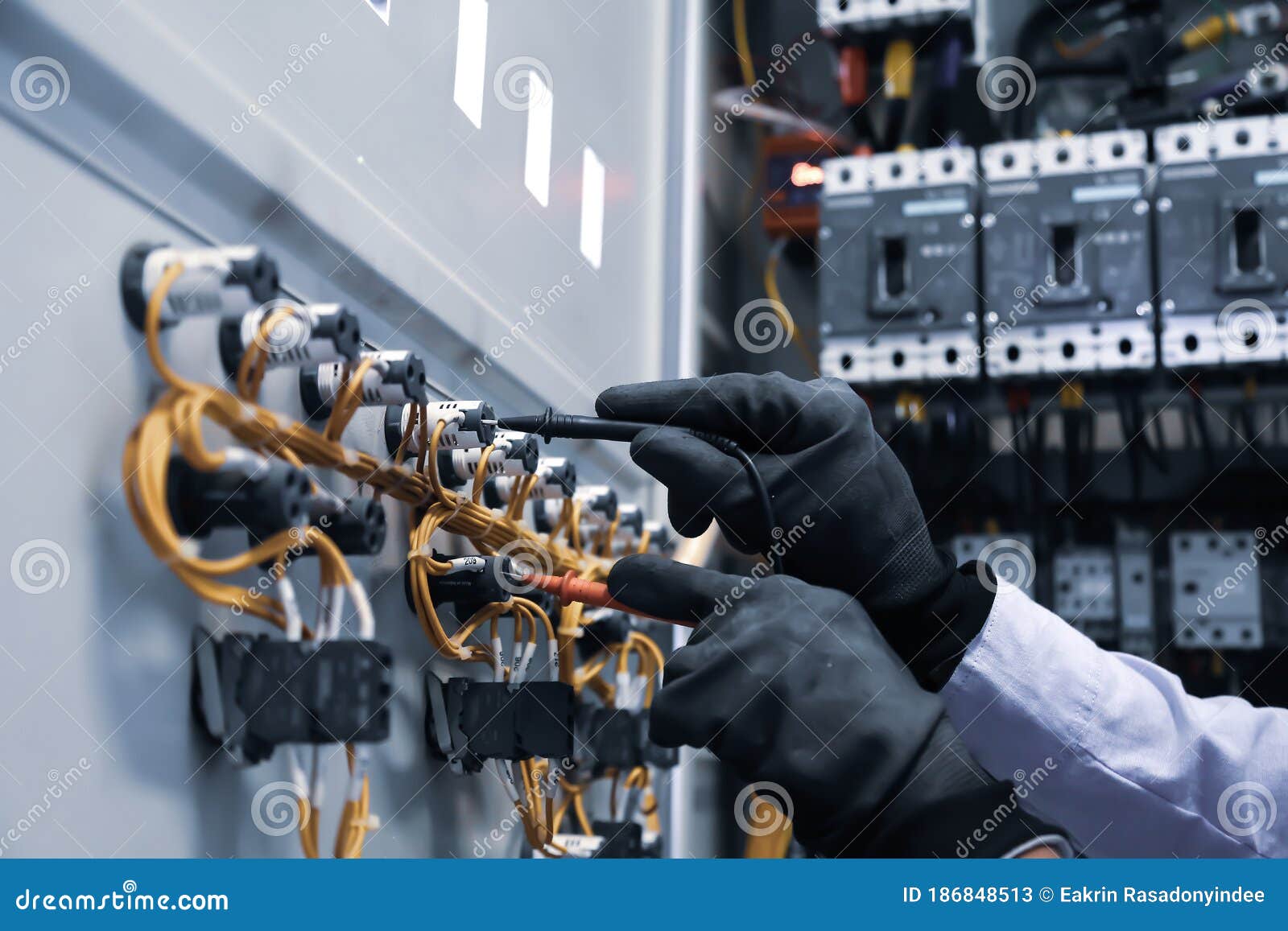 Electrical Engineer Using Digital Multi-meter Measuring Equipment To ...