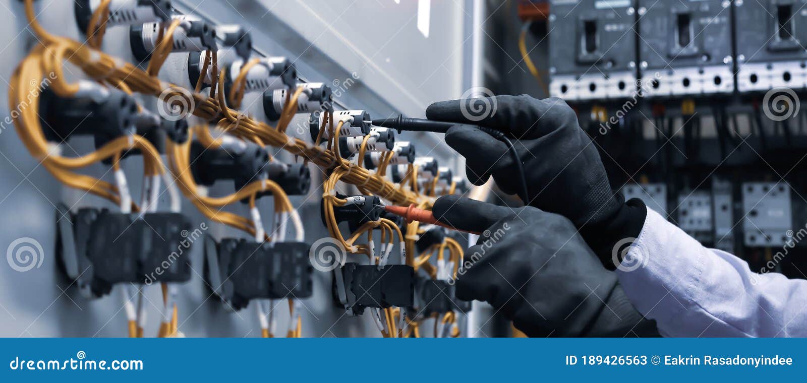 Electrical Engineer Using Digital Multi-meter Measuring Equipment To ...