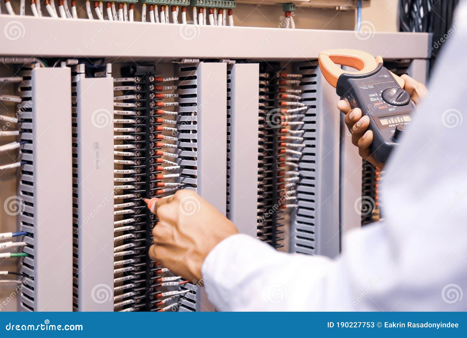 Electrical Engineer Using Digital Multi-meter Measuring Equipment To ...