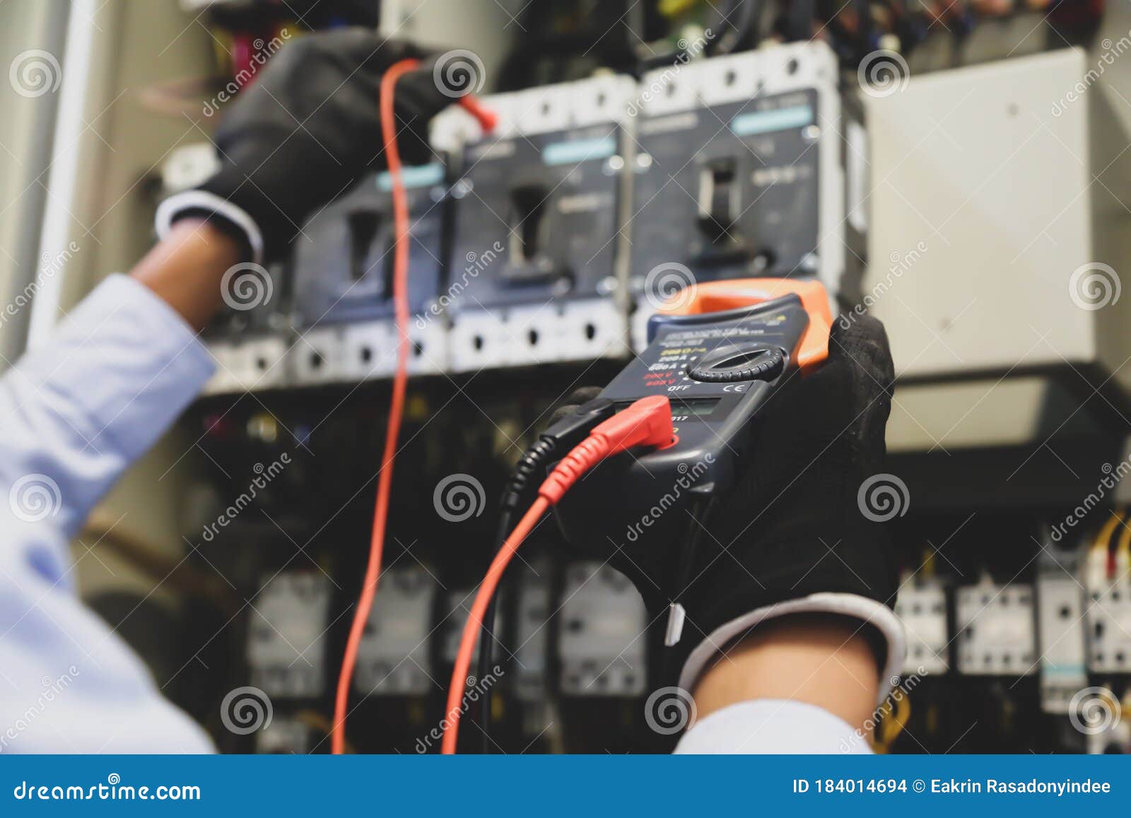 Electrical Engineer Using Digital Multi-meter To Check Current Voltage ...