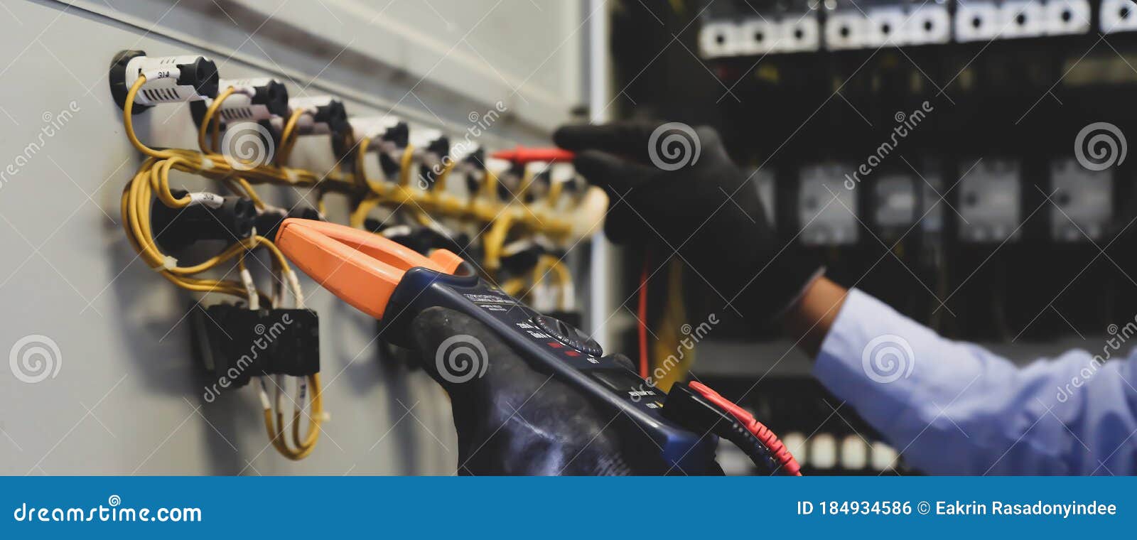 Electrical Engineer Using Digital Multi-meter To Check Current Voltage ...