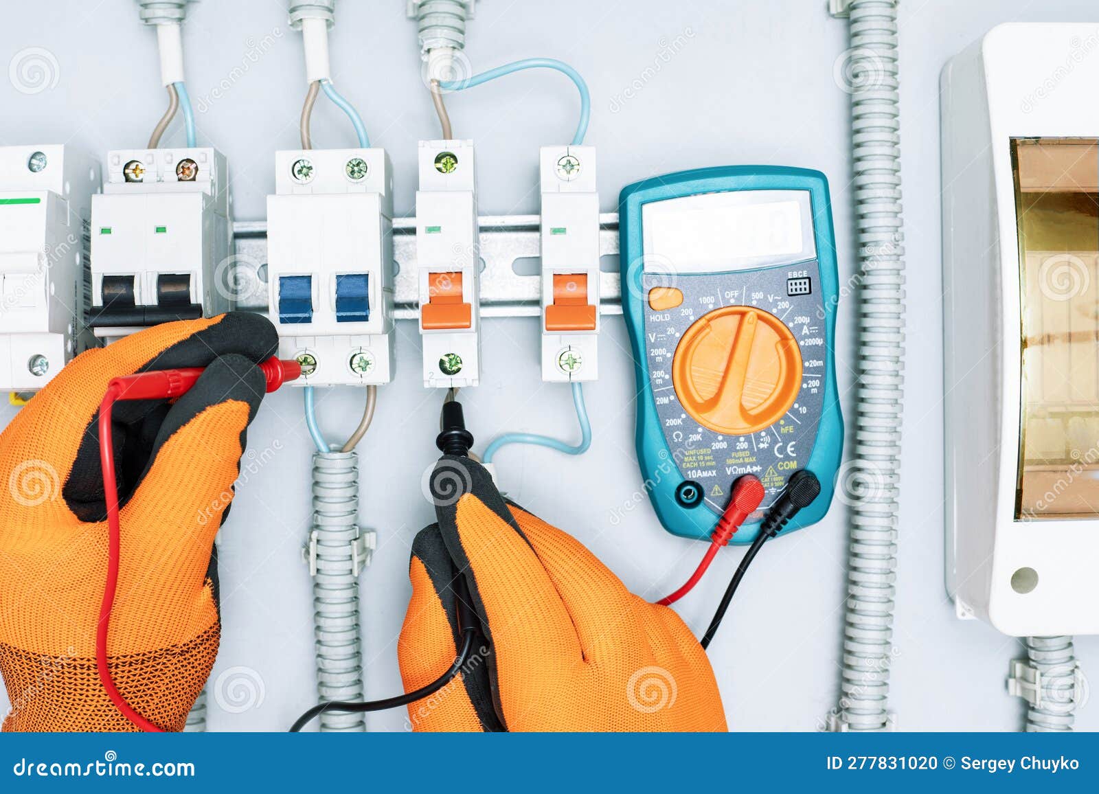 Electrical Engineer Using Digital Multi-meter To Check Current Voltage ...