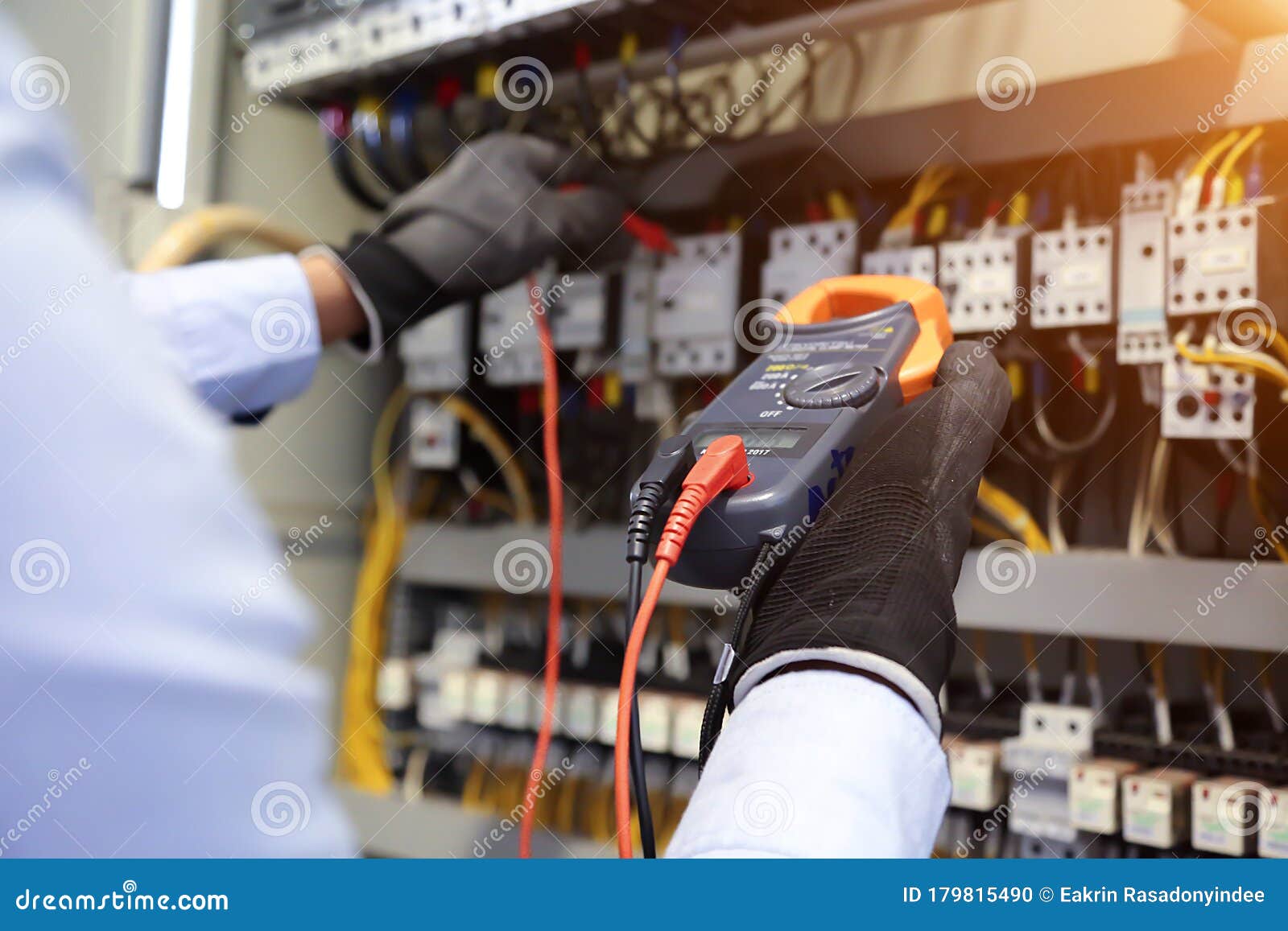 Electrical Engineer Using Digital Multi-meter To Check Current Voltage ...