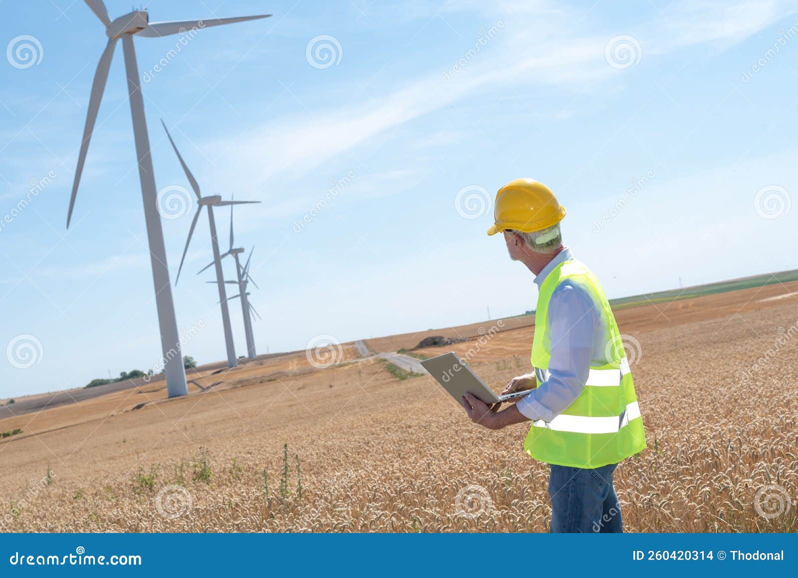 Engineer Using Laptop for Wind Turbine Inspection Stock Photo - Image ...