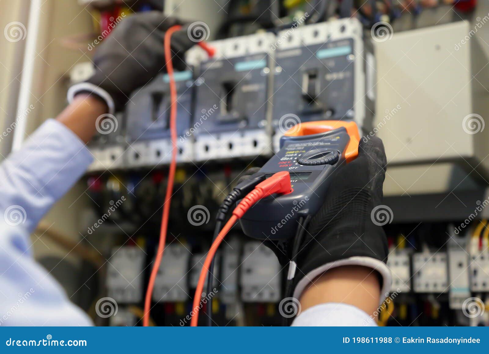 Electrical Engineer Using Measuring Equipment To Checking Electric ...