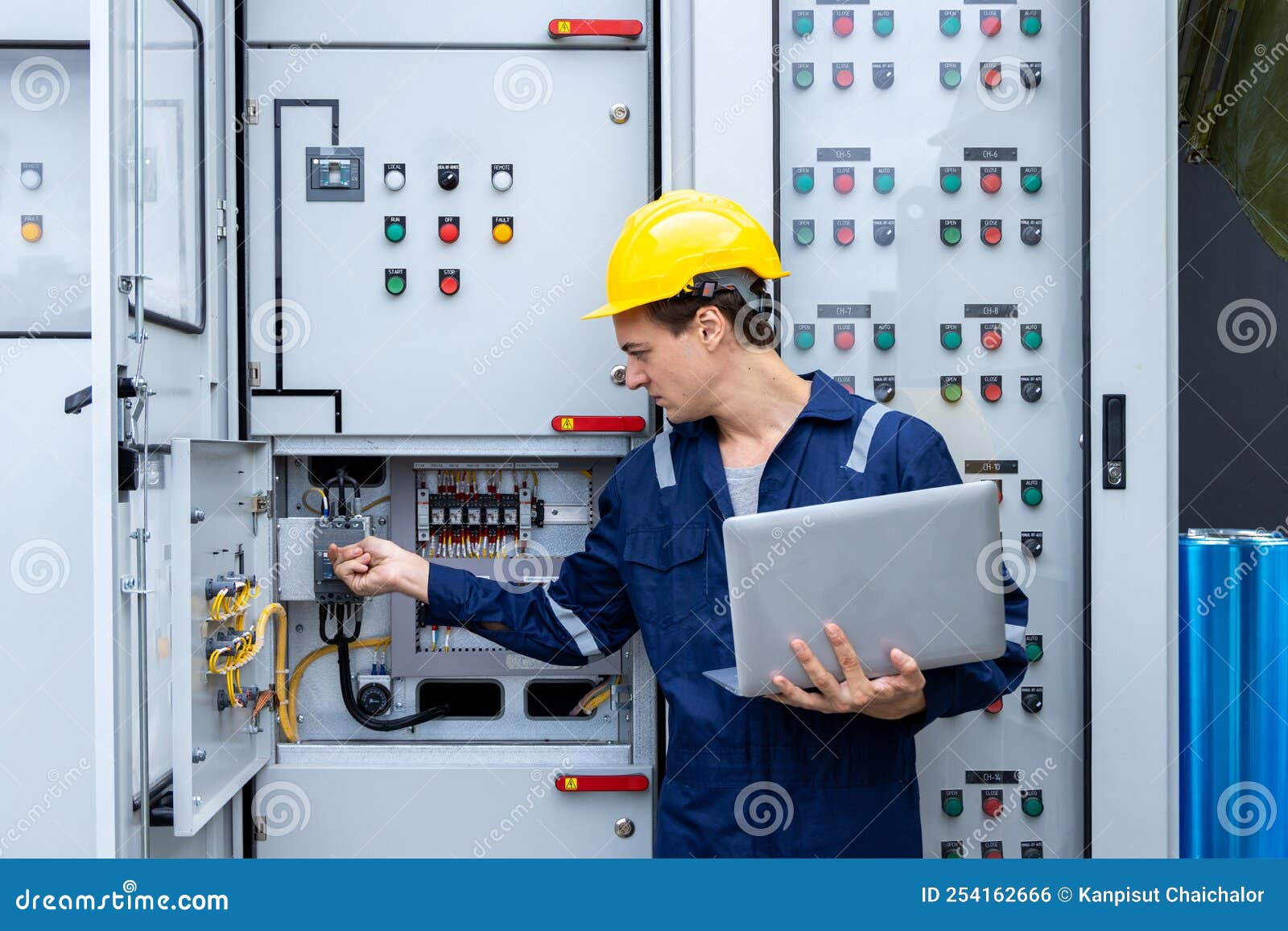Electrical Engineer Working in Control Room. Electrical Engineer Man ...