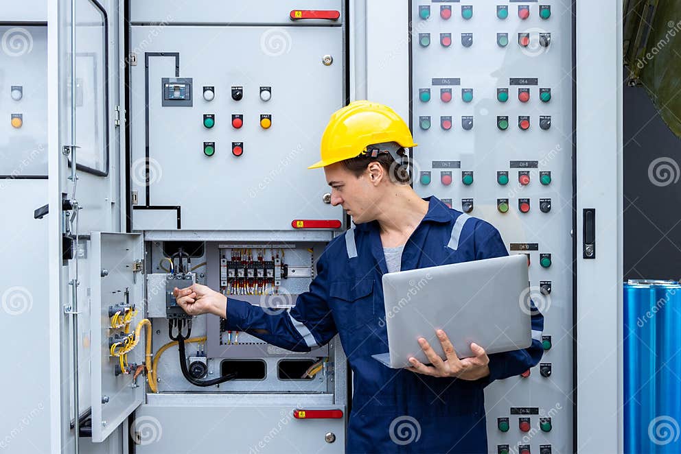 Electrical Engineer Working in Control Room. Electrical Engineer Man Checking Power Distribution ...