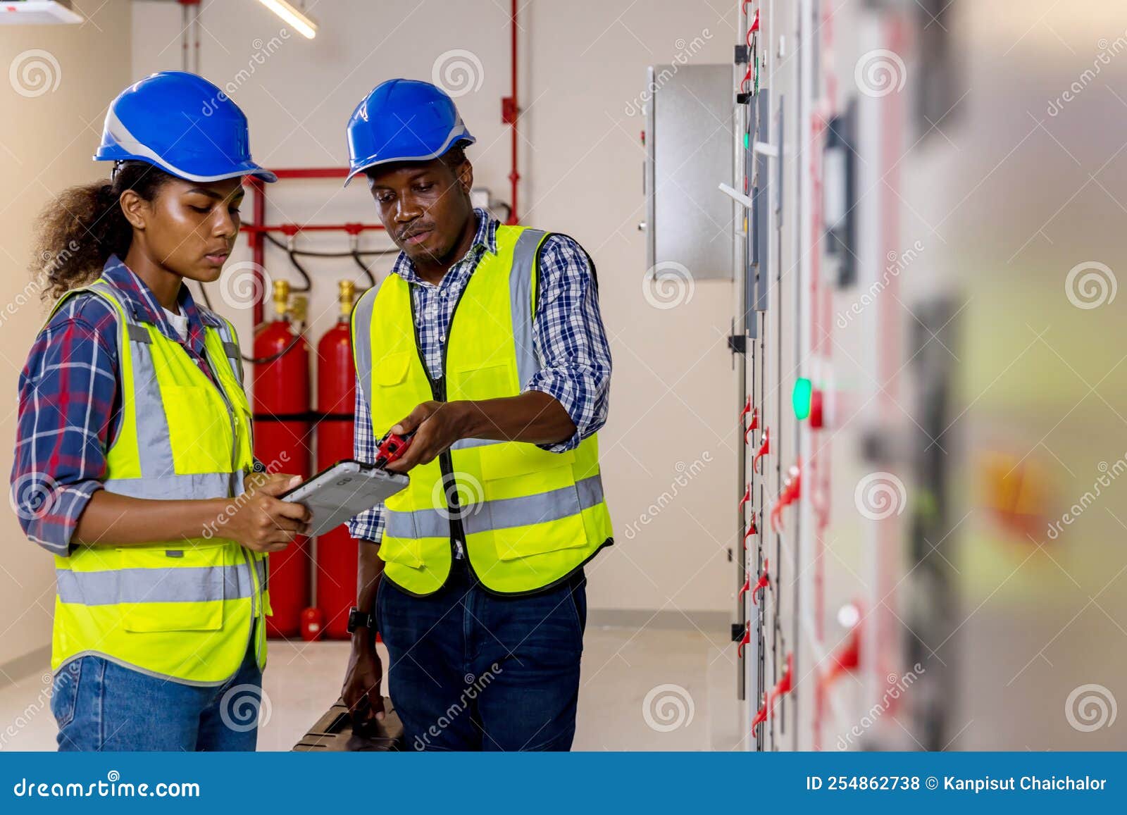Electrical Engineer Working in Control Room. Electrical Engineer Man ...