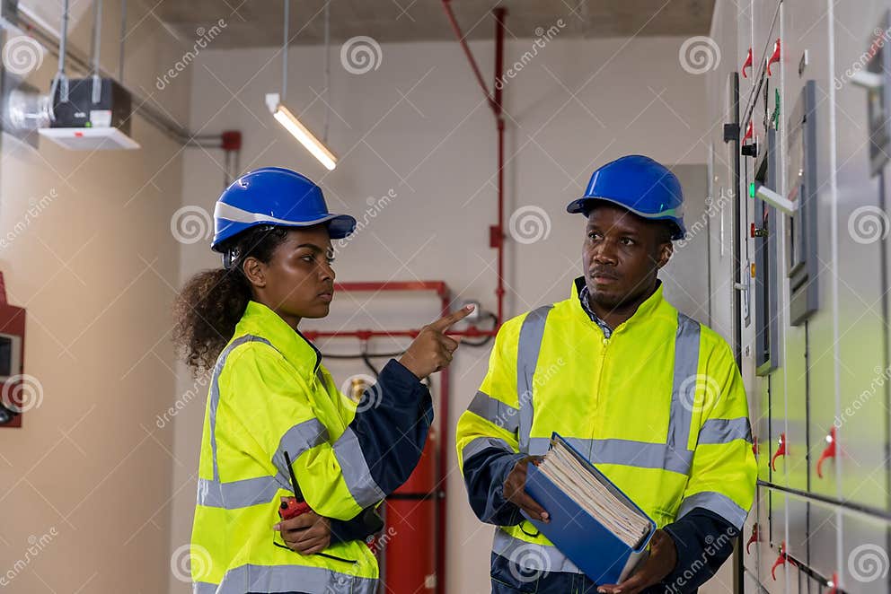 Electrical Engineer Working in Control Room. Electrical Engineer Man ...