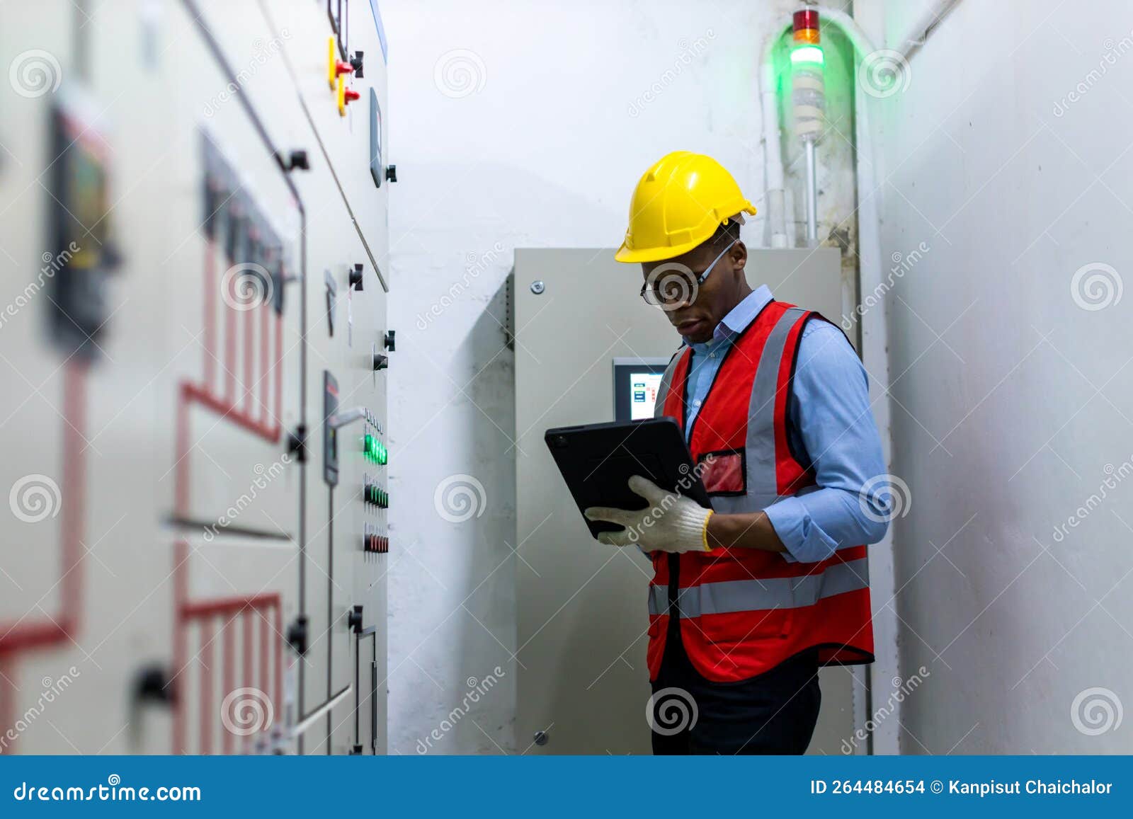 Electrical Engineer Working in Control Room. Electrical Engineer Man ...