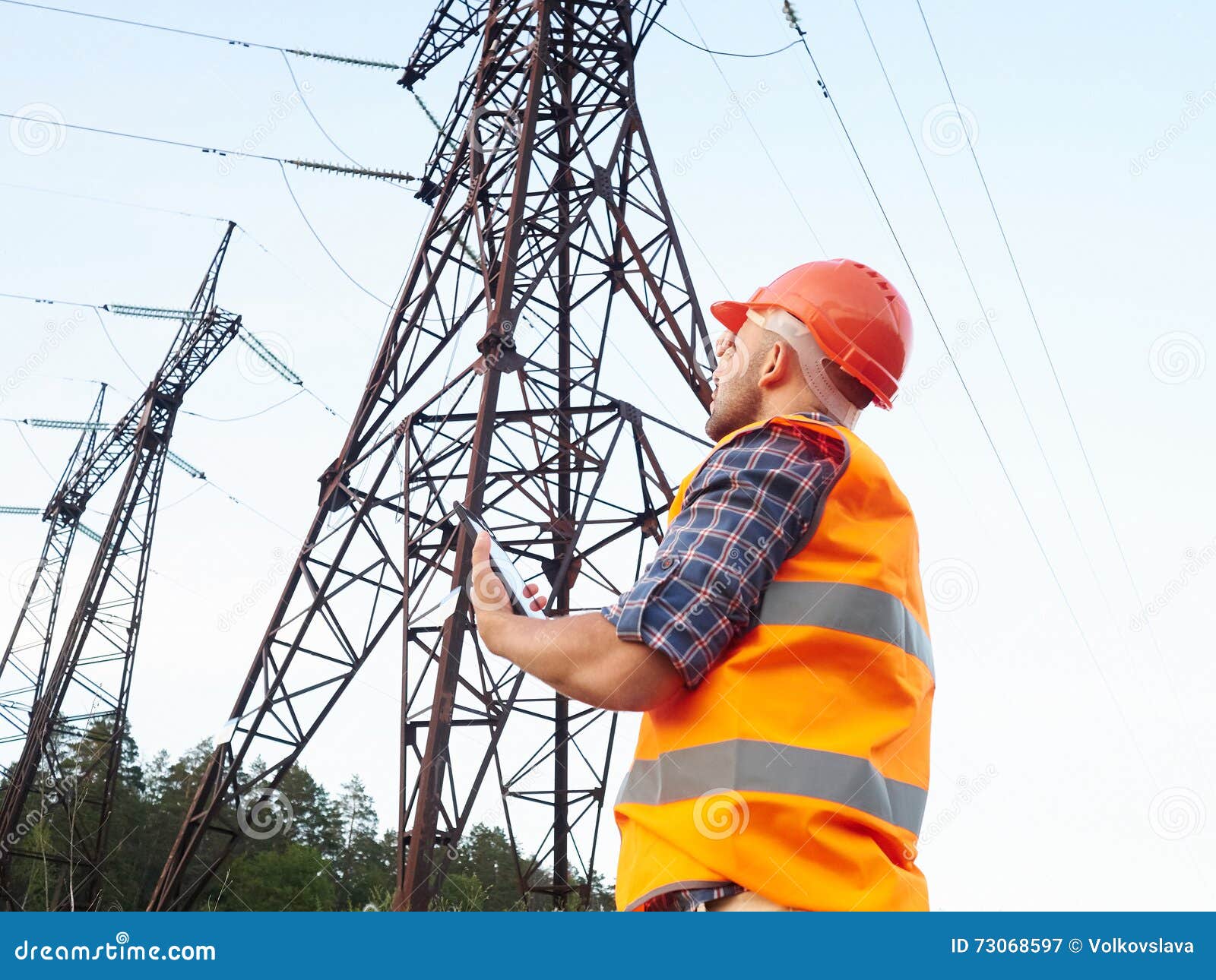 Electrical Engineer Working. Talking on the Phone and Working on Stock ...