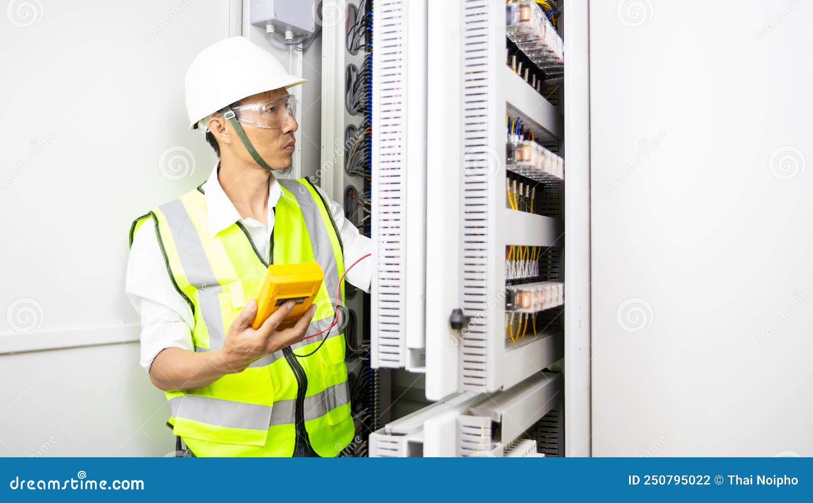 Electrical engineering man stock photo. Image of installation - 250795022