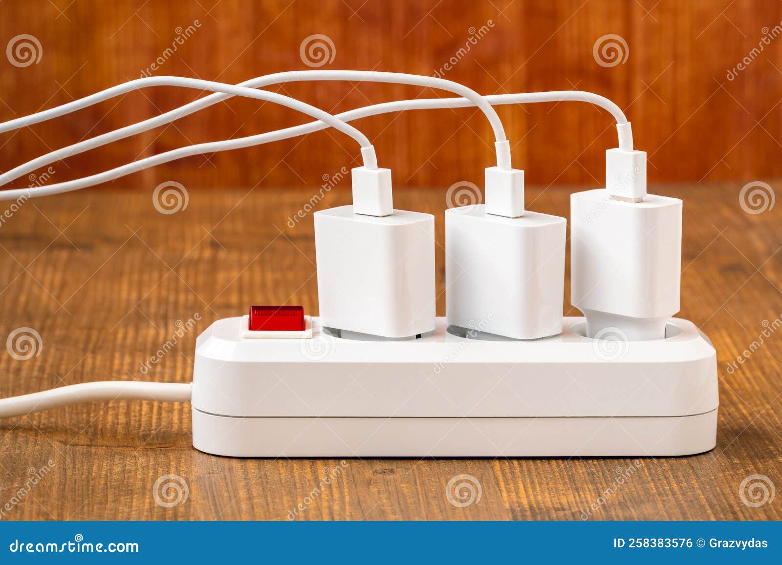 The Electrical Extension Strip with Connected White Power Plugs on the ...