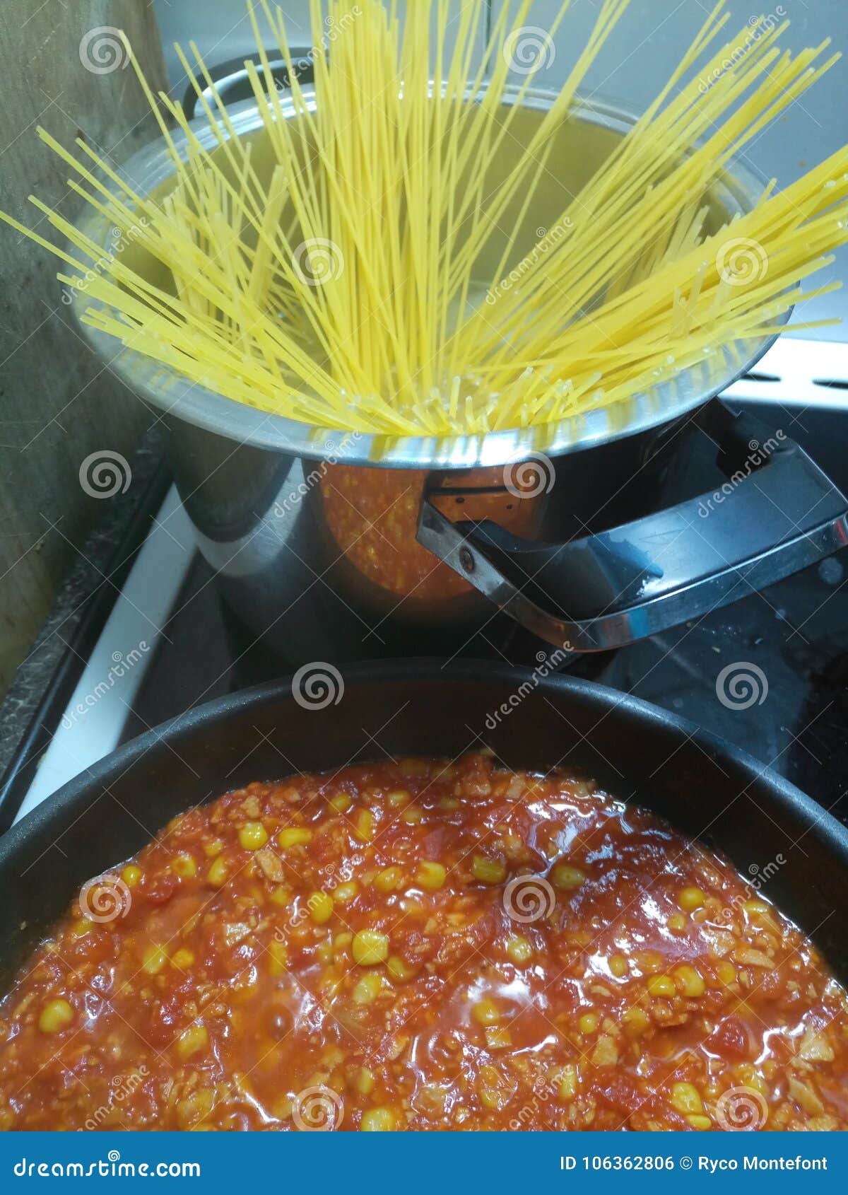 Uncooked Spaghetti Sticks in a Pot with Diced Ham Cooking G Stock Photo ...